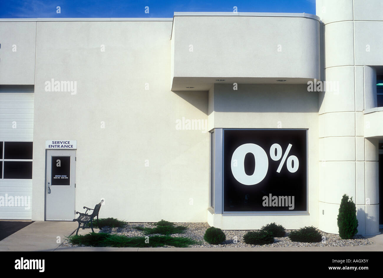 automotive service building with zero percent financing sign in window ...