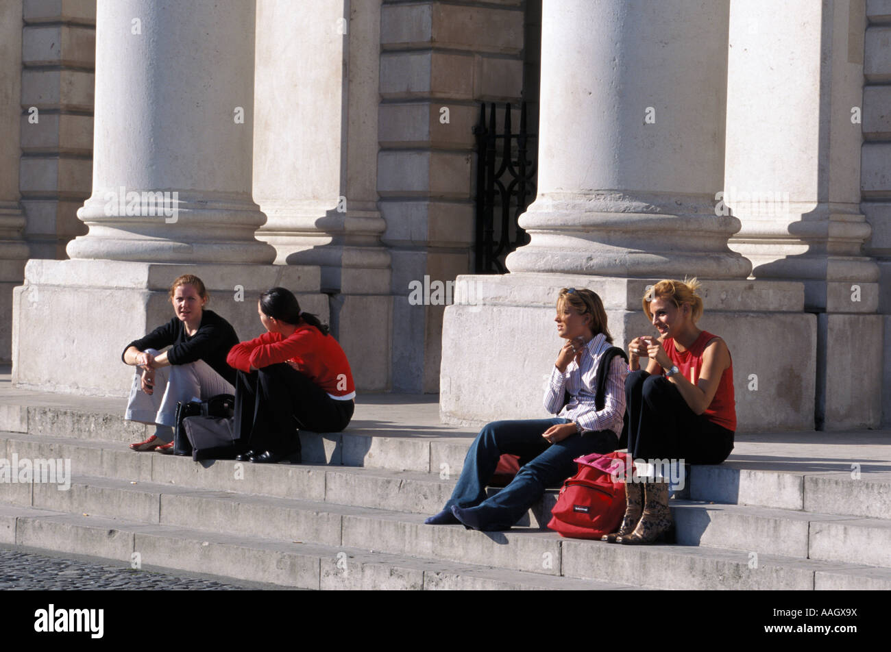 Four female student sitting in stairs Trinity College Dublin Ireland ...