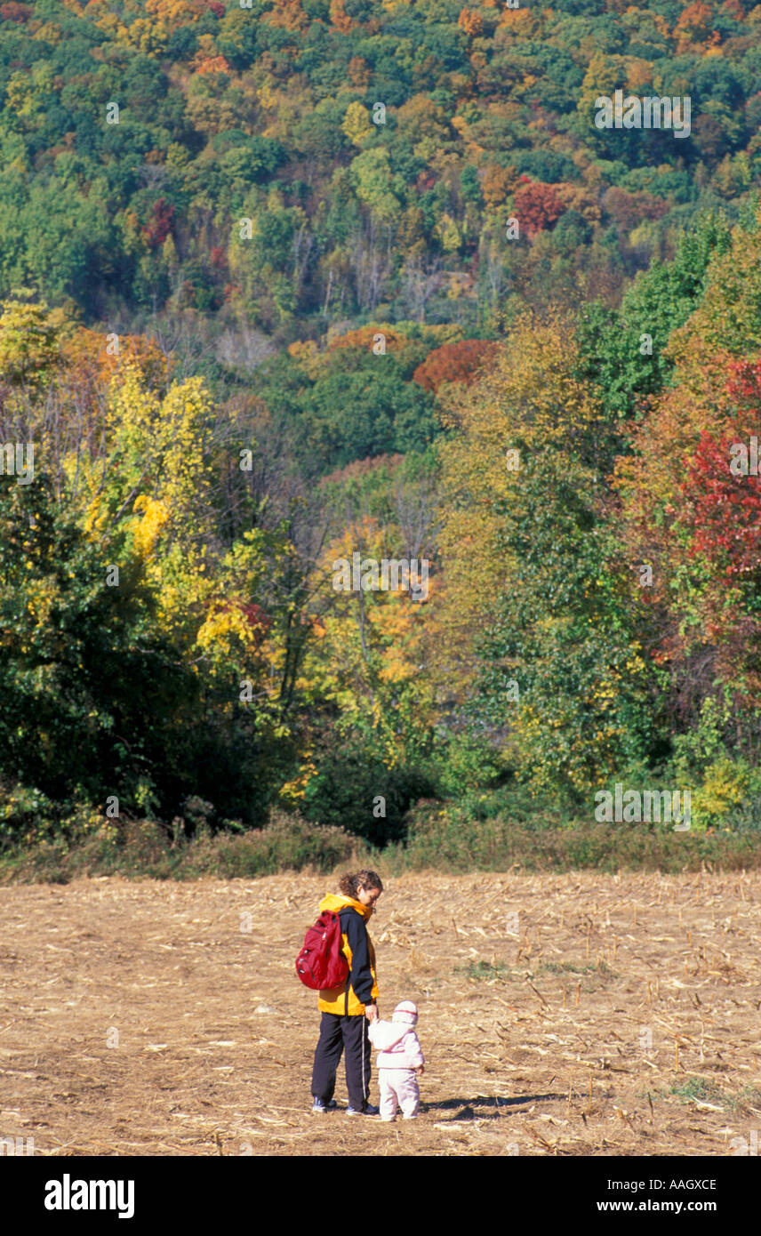 A woman and her young daughter explore the scenic corn fields on the ...