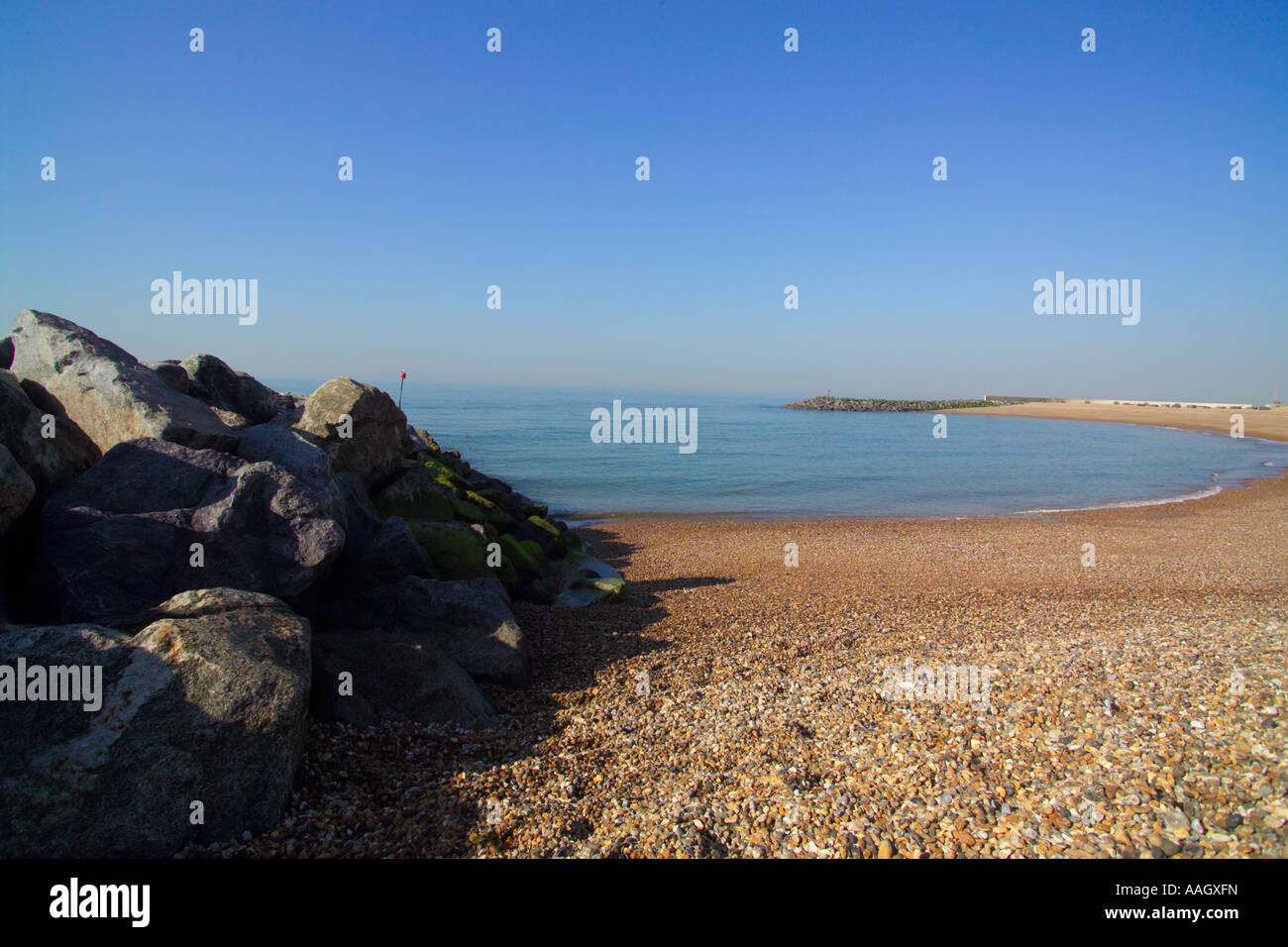 rocks that form the sea defences on Folkestone Beach Kent England Stock ...
