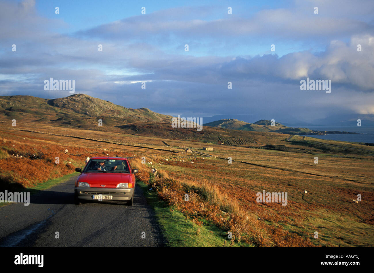 Red car on Atlantic drive Achill Island County Mayo Ireland Stock Photo ...
