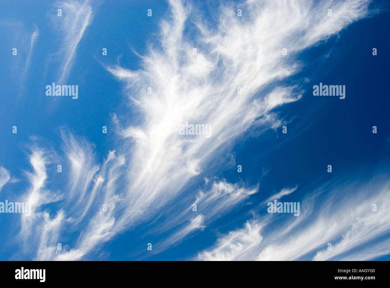 Sky blue white cirrus wisps clouds hi-res stock photography and images ...