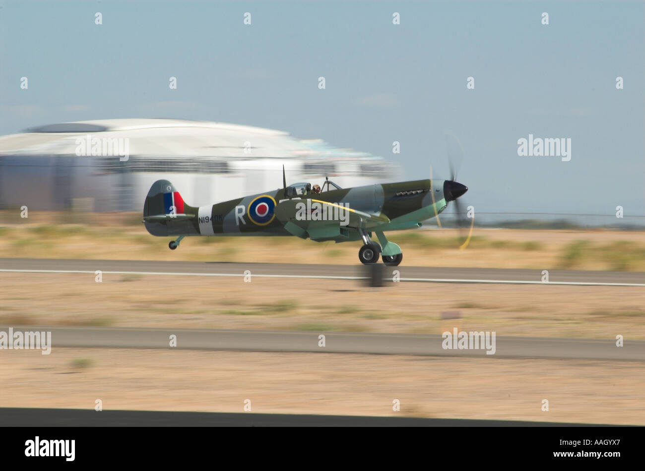 A Supermarine Spitfire taxis down the runway to take off (front quarter ...