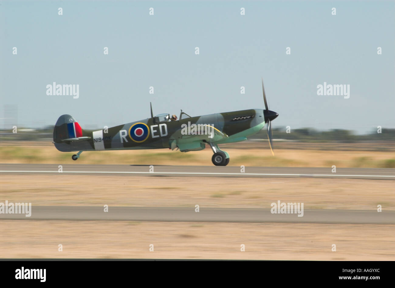 A Supermarine Spitfire taxis down the runway to takeoff (side view ...