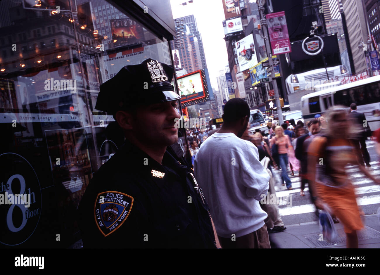 Police officer in Times Square protecting the public against crime and ...