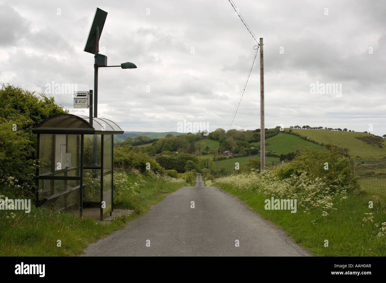 isolated bus stop with solar powered light on Remote rural country road ...