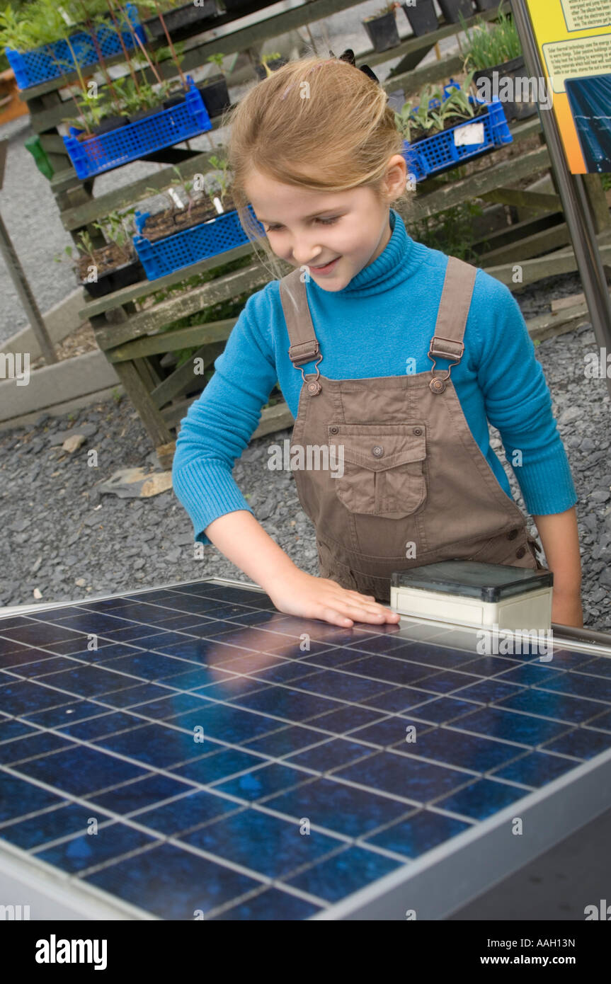 Solar power demonstration display with young girl interacting the ...