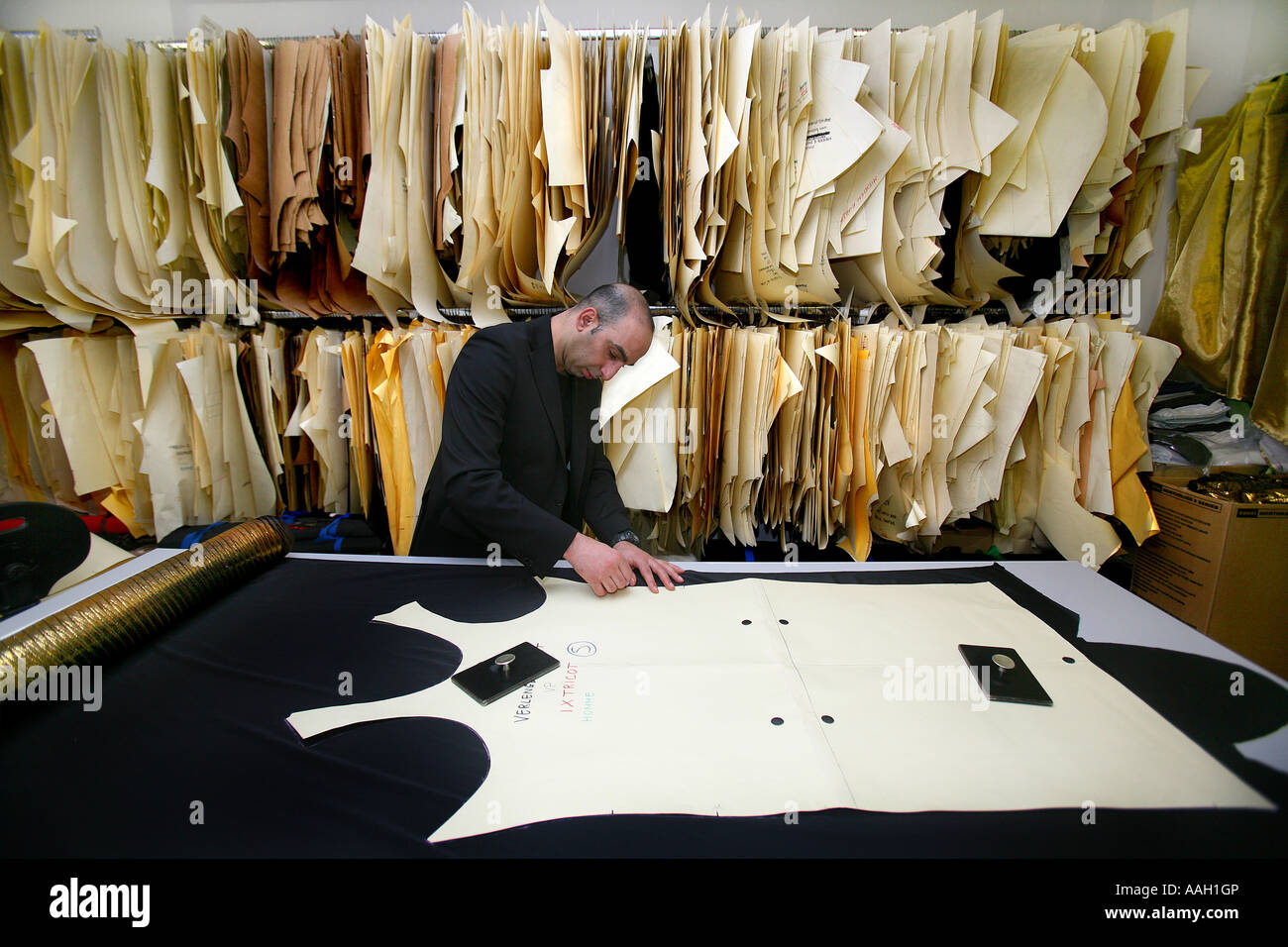 Fashion designer at work in his studio editorial use only no negative ...