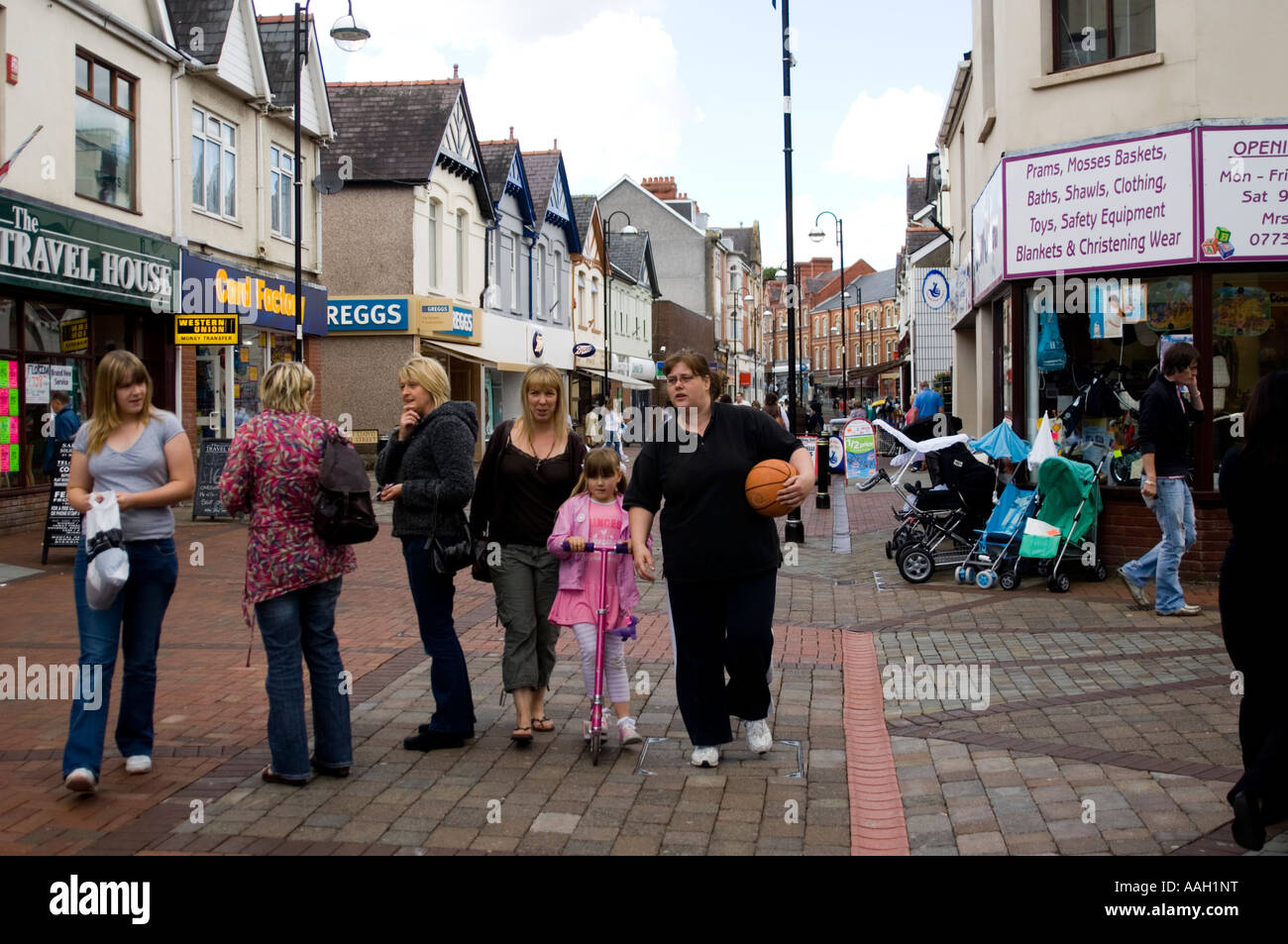 People shopping in AMMANFORD town centre Carmarthenshire west wales UK ...