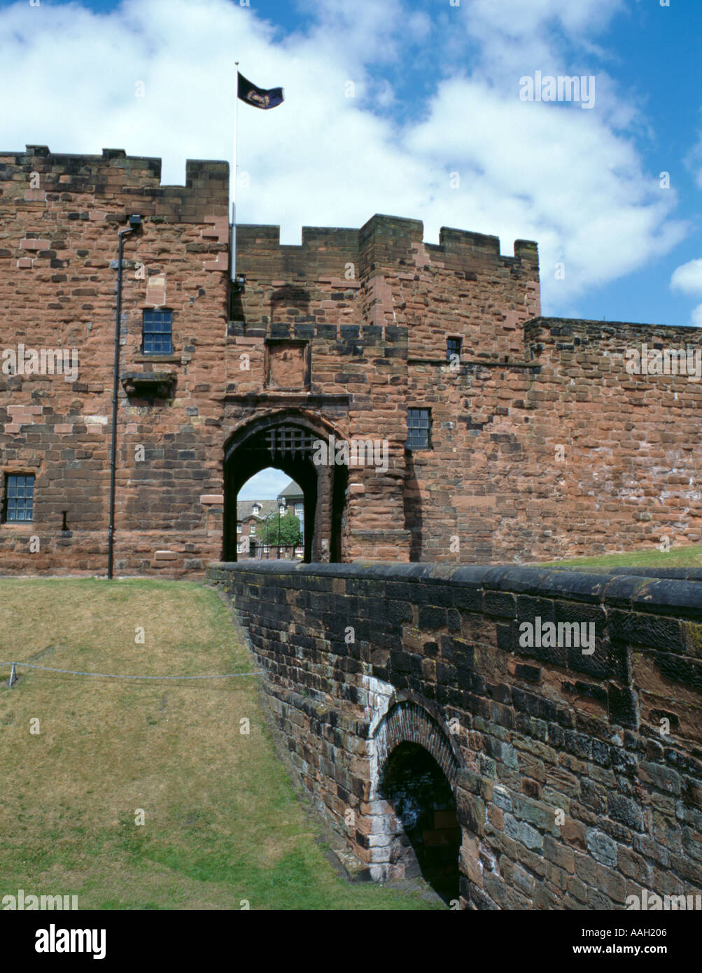 Red sandstone outer gatehouse, bridge and earthworks of Carlisle Castle ...