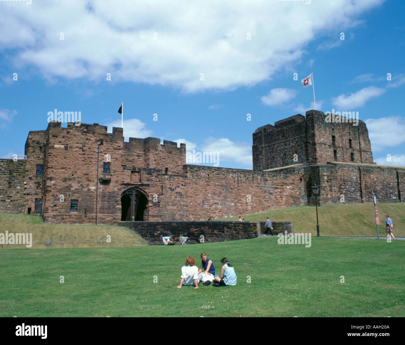Outer gatehouse, red sandstone walls and Norman keep of Carlisle Castle ...