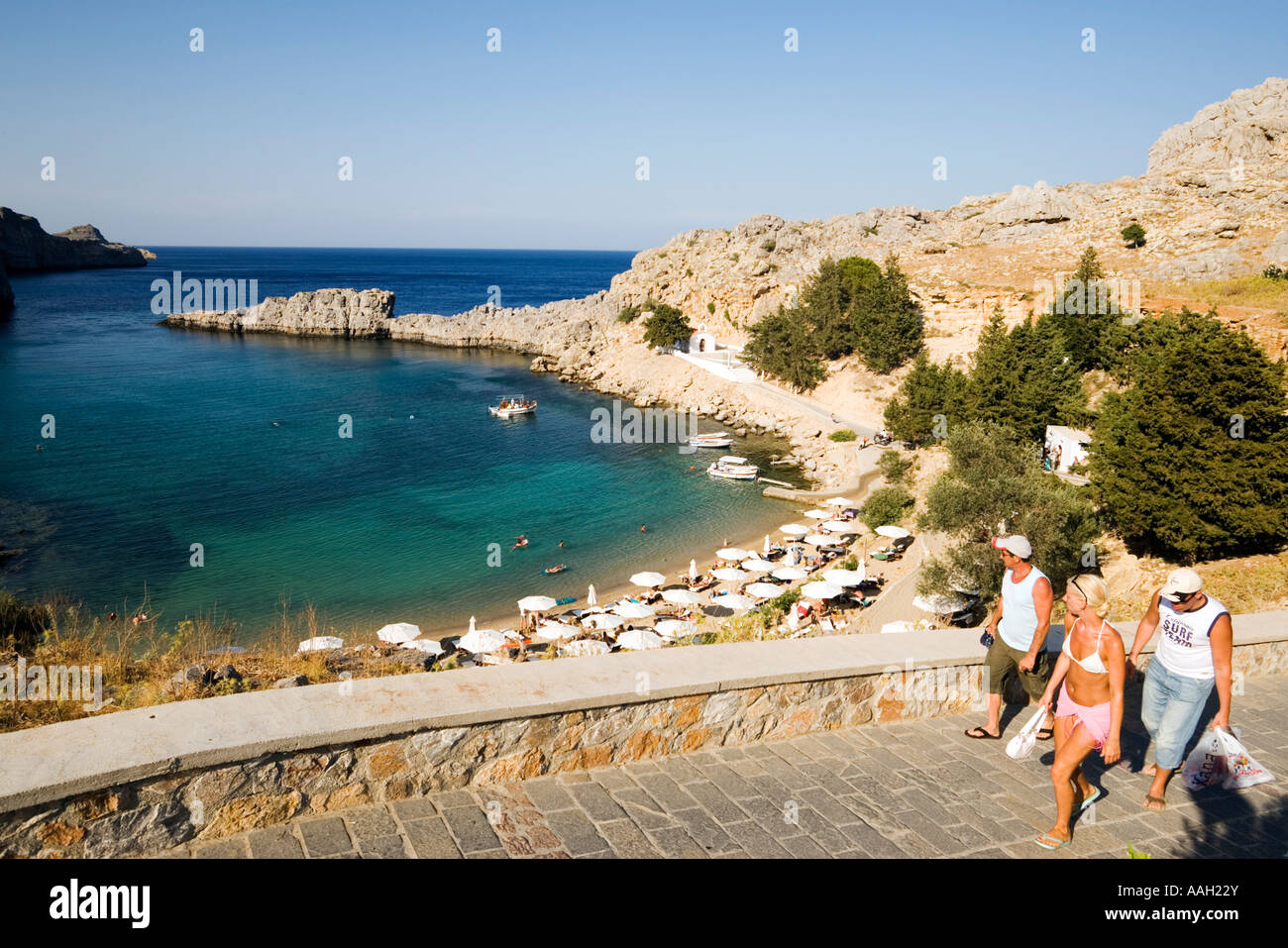 Elevated view of beach at Saint Paul s Bay Agios Pavlos people passing Lindos Rhodes Greece ...