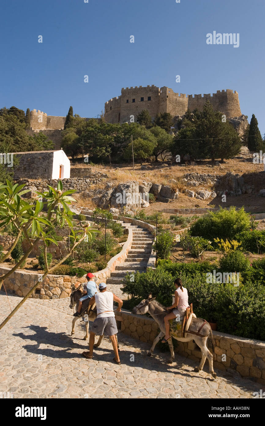 Tourists riding on donkeys to Acropolis Lindos Rhodes Greece Stock ...