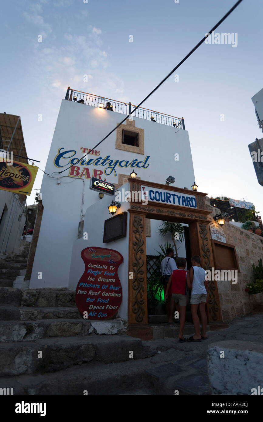 People standing in front of the Courtyard Bar Lindos Rhodes Greece ...