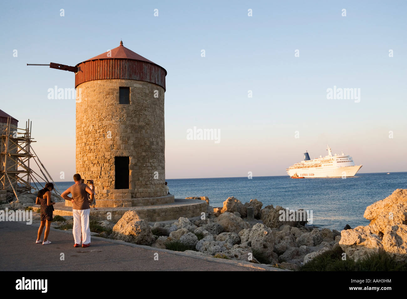 windmills on mole at Mandraki harbour translated literally fold cruiser ...