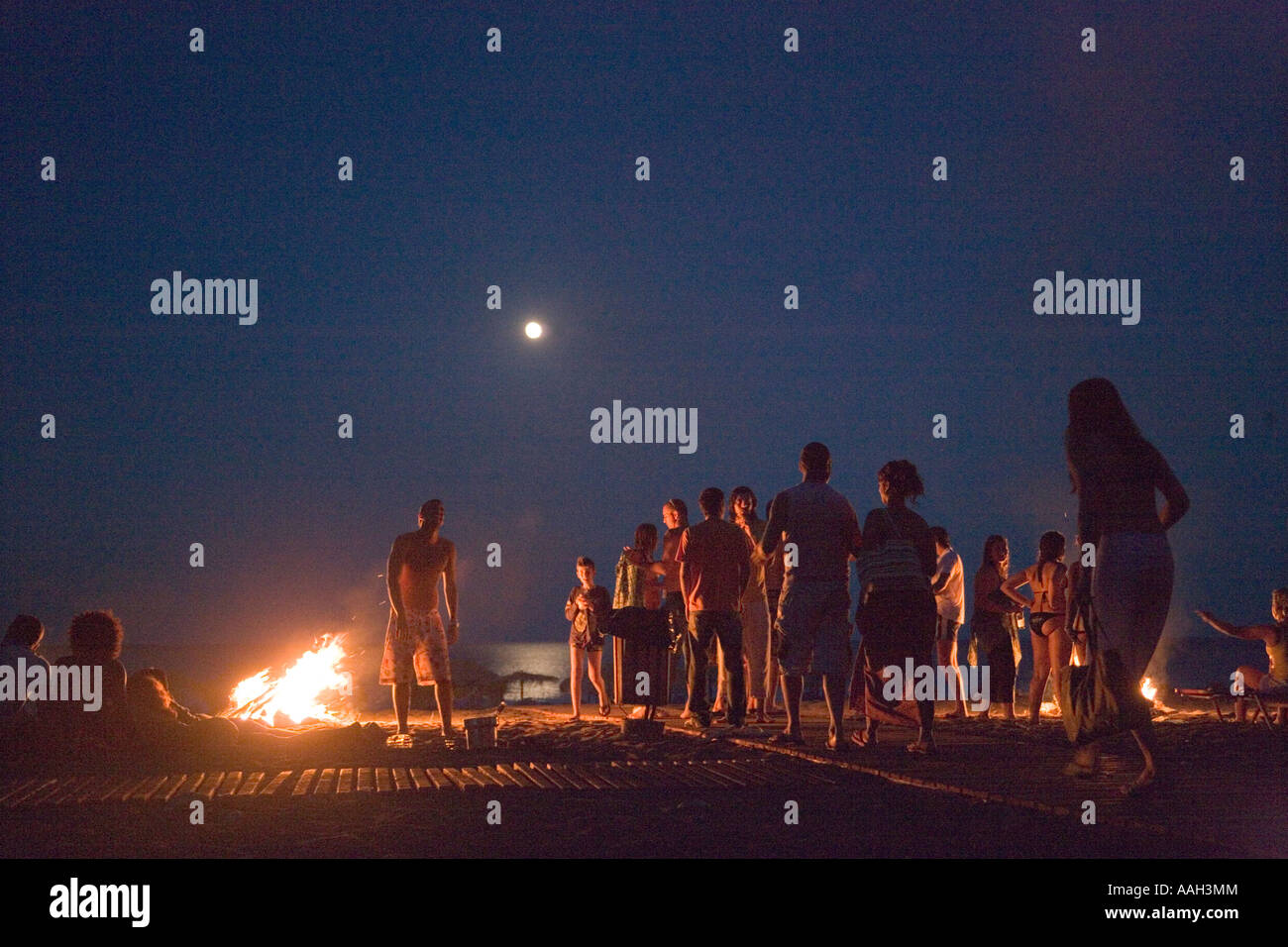 Young people at beach near campfire sunday party at Sundance Beach Bar ...