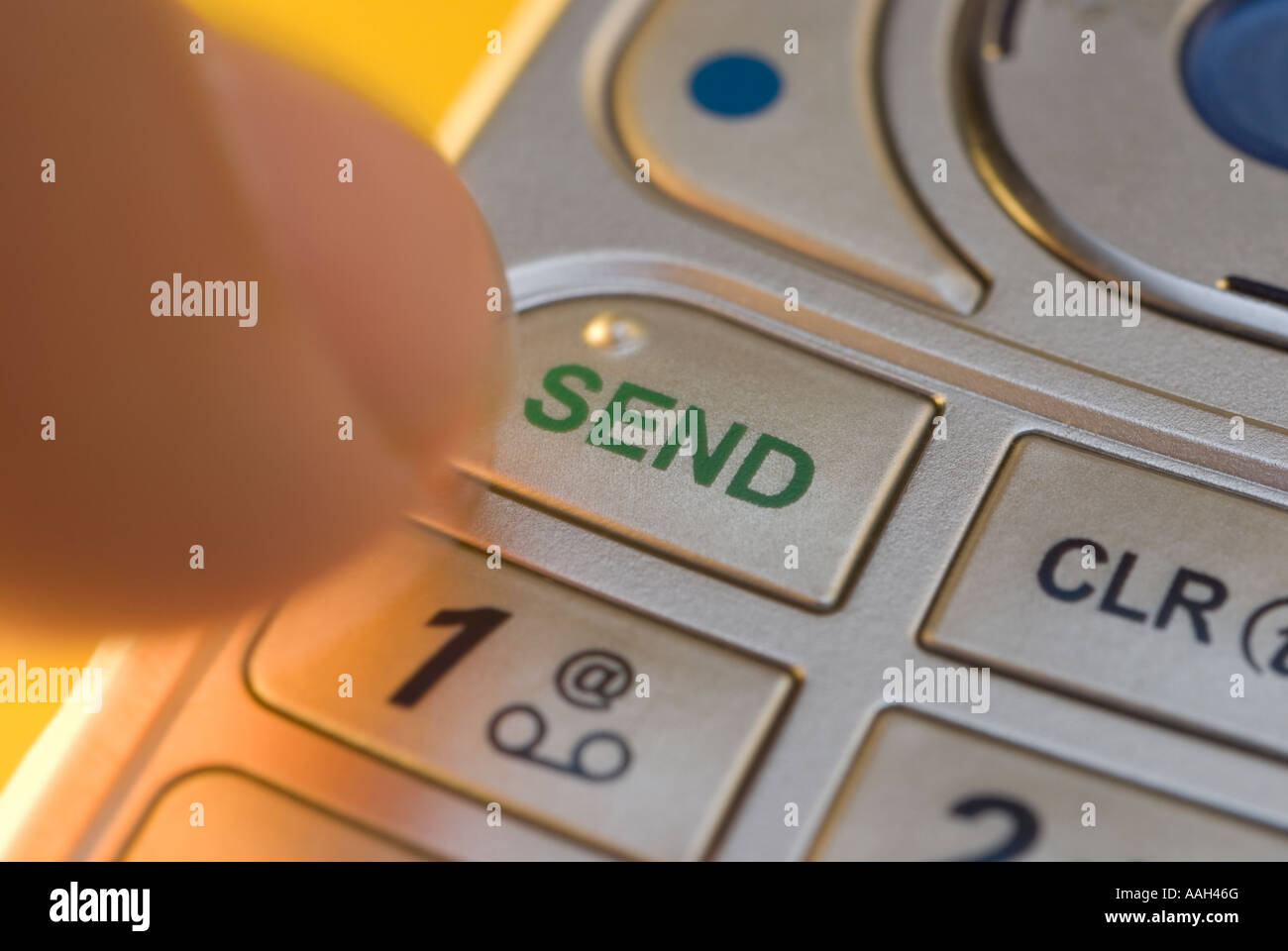 a closeup of a finger pressing the send button on a cellphone Stock ...