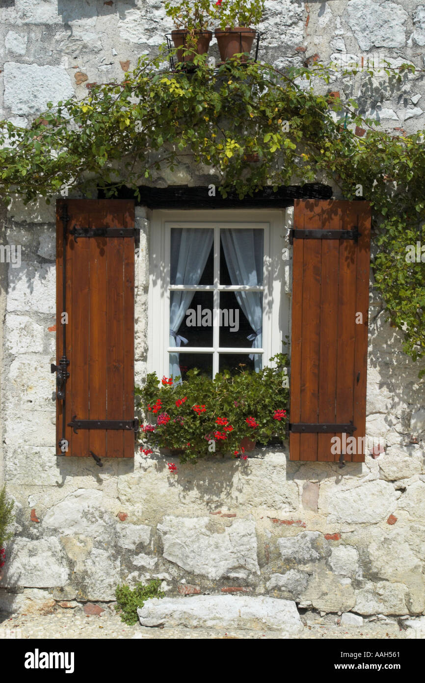 Window shutters on medieval house in Pujols Bordeaux France Stock Photo ...