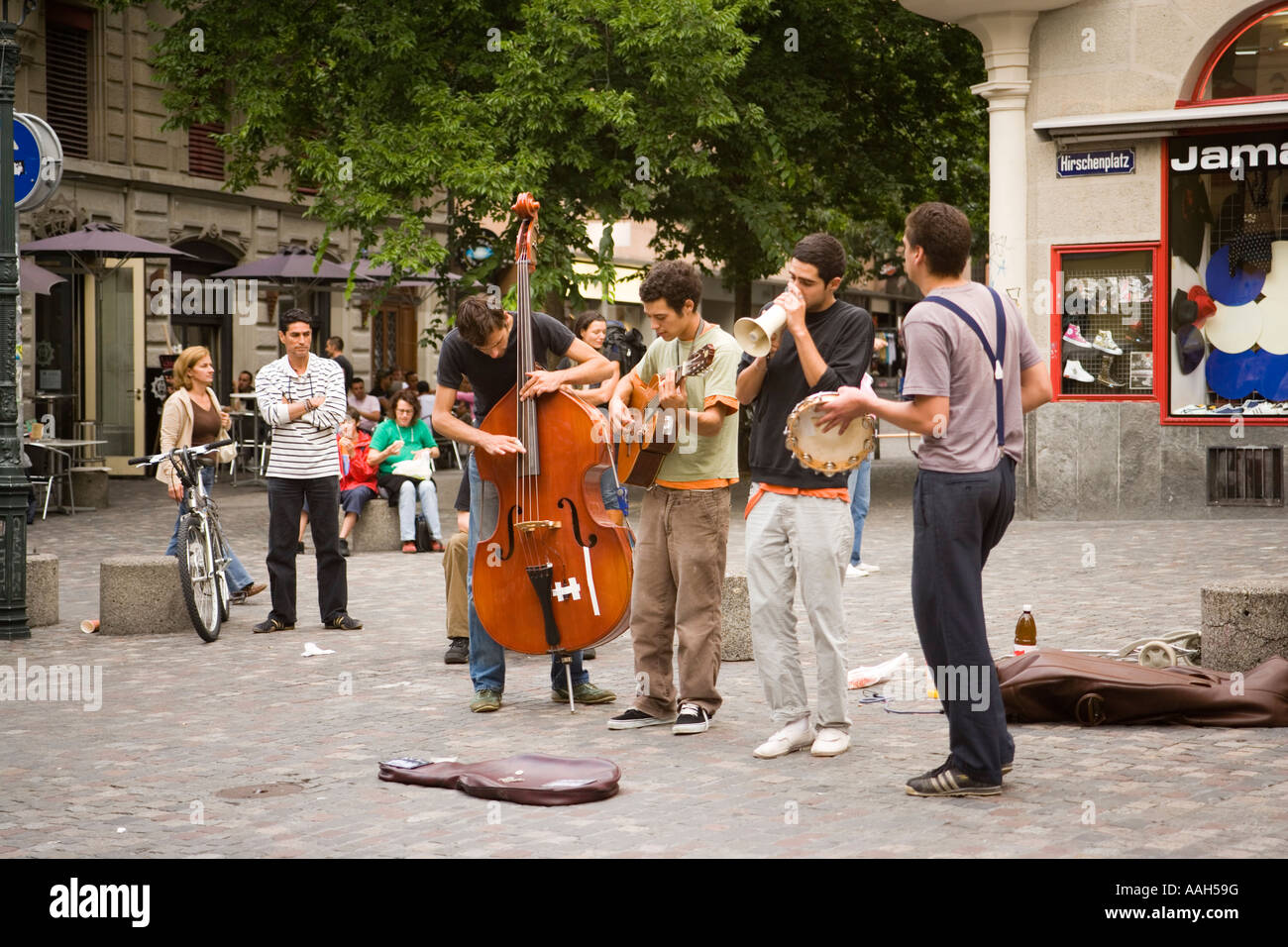 Group of young men making music on the Hirschenplatz Niederdorfstrasse ...