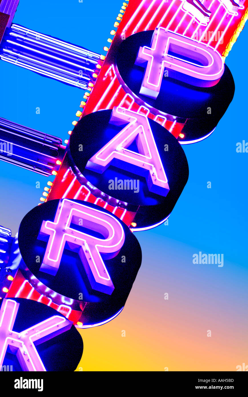 Colorful brightly lit neon parking sign at dusk Stock Photo - Alamy