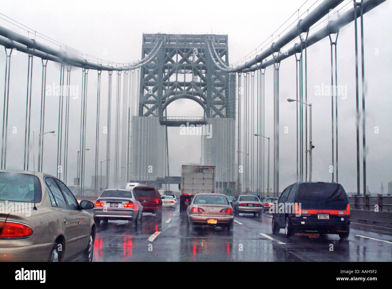 Bumper to bumper traffic on rainy bridge roadway Stock Photo - Alamy