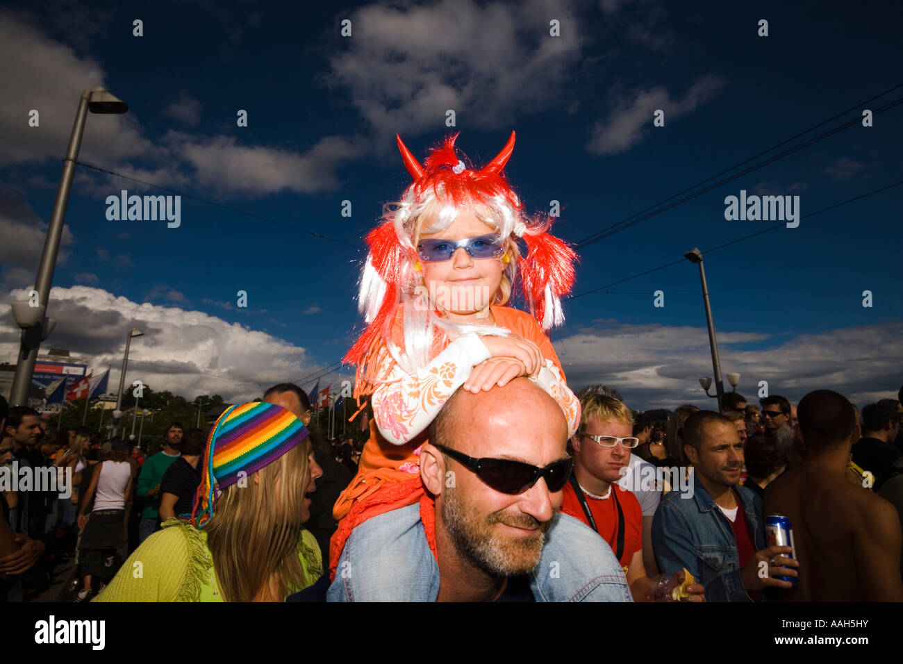 Flashy dressed up girl sitting on father s shoulder Street Parade near ...