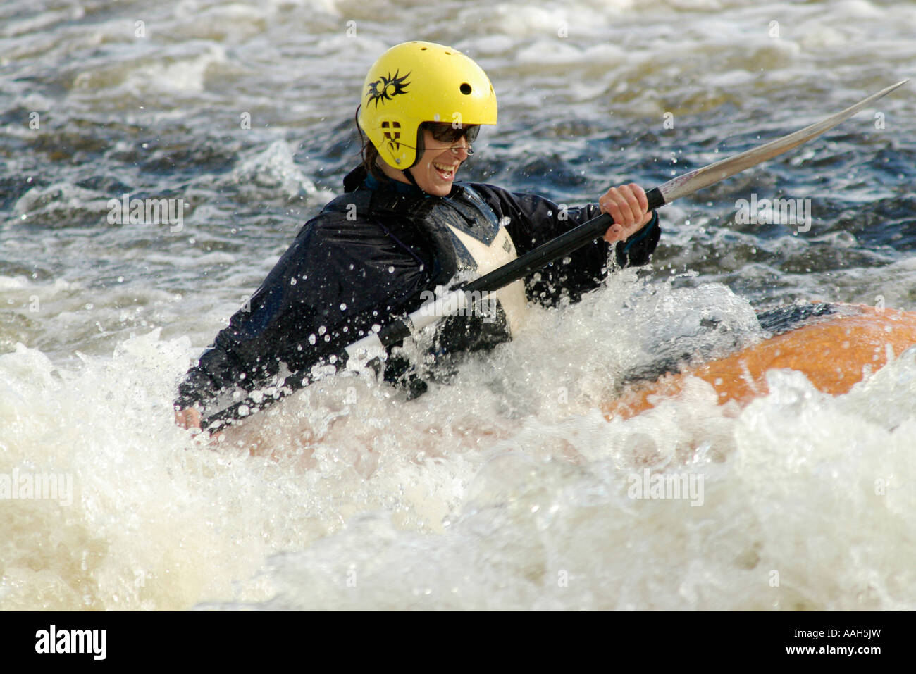 Telephoto shot of a kayaker in action Stock Photo - Alamy
