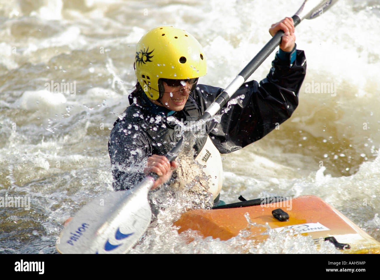 Telephoto shot of a kayaker in action Stock Photo - Alamy