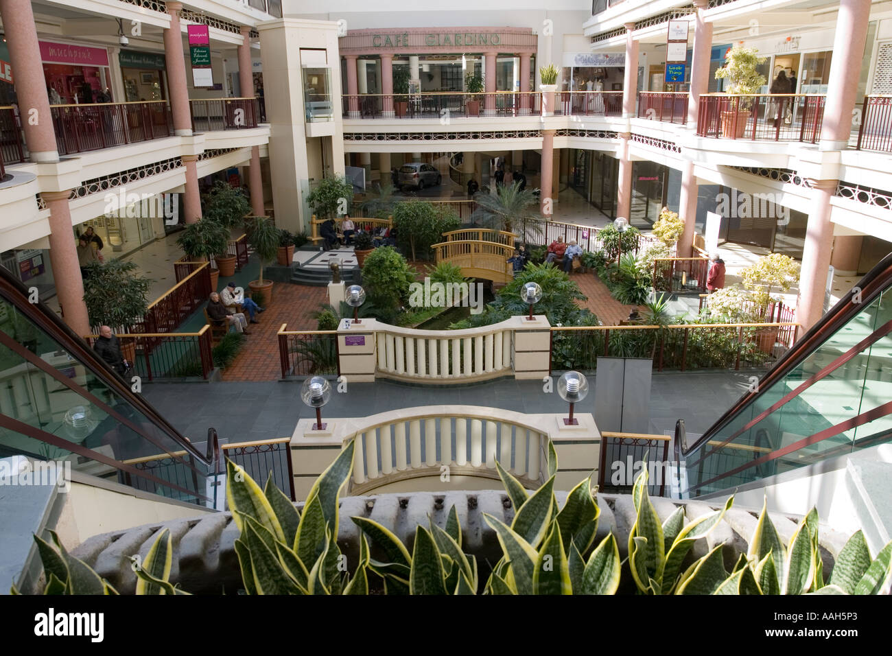 Rest area with trees and water feature inside the Beechwood Shopping ...