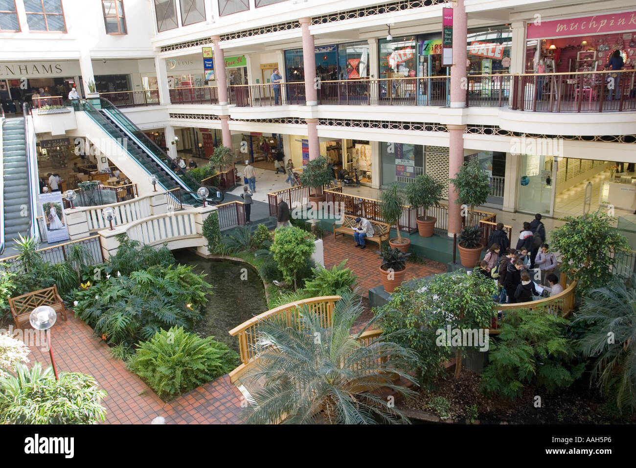 Rest area with trees and water feature inside the Beechwood Shopping ...
