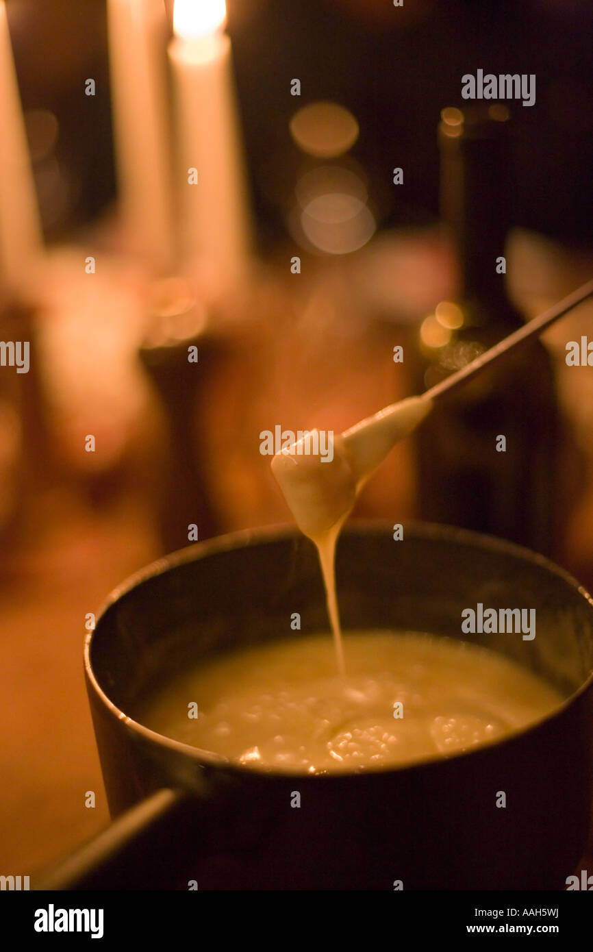 People having a cheese fondue Fondue Hut of the Restaurant and Hotel ...
