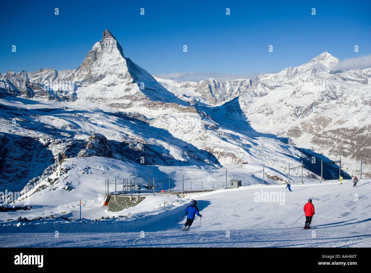 Skier on mountain slope Matterhorn 4478 m in background Zermatt Valais ...