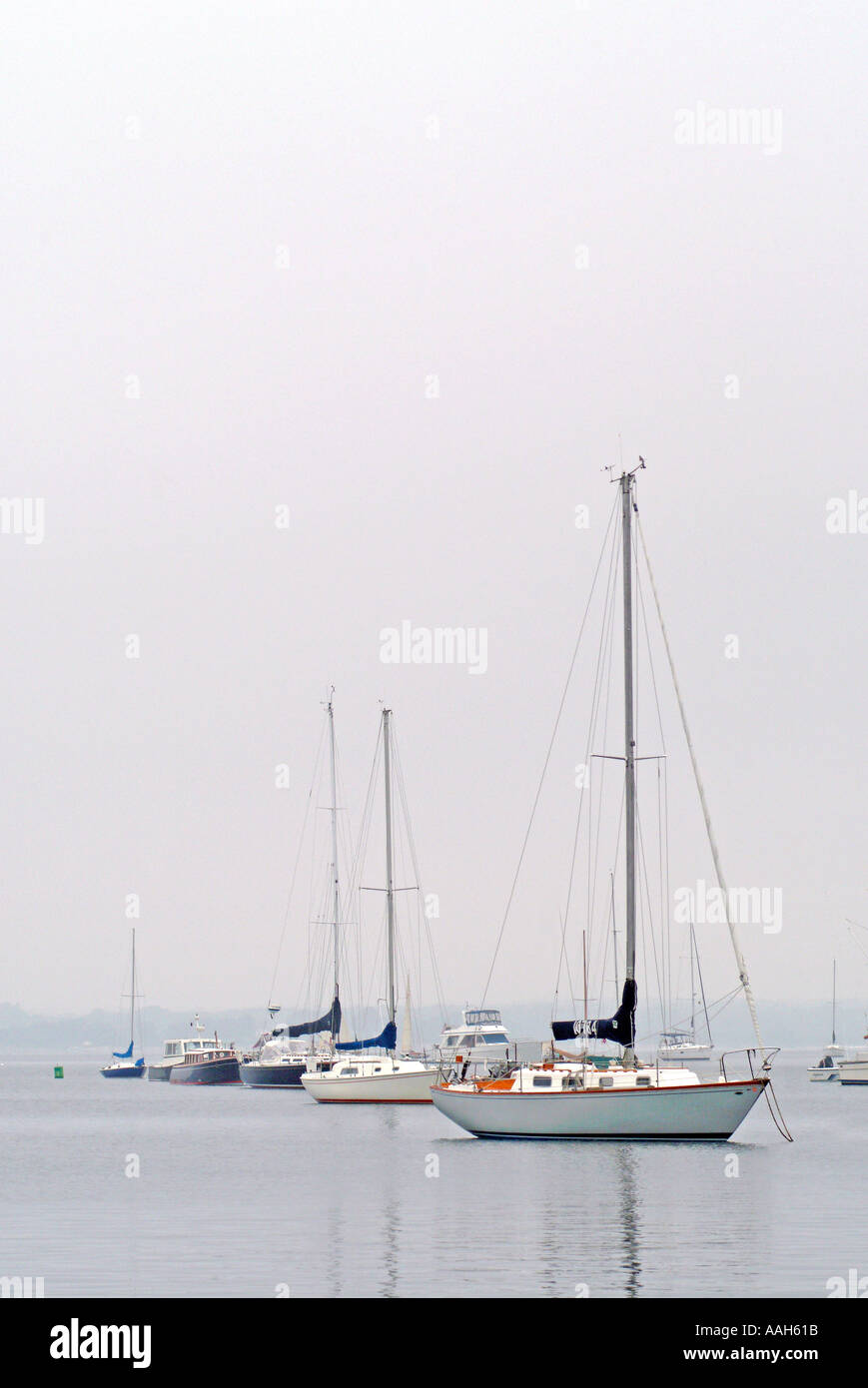 Sailboats in mist Stock Photo - Alamy