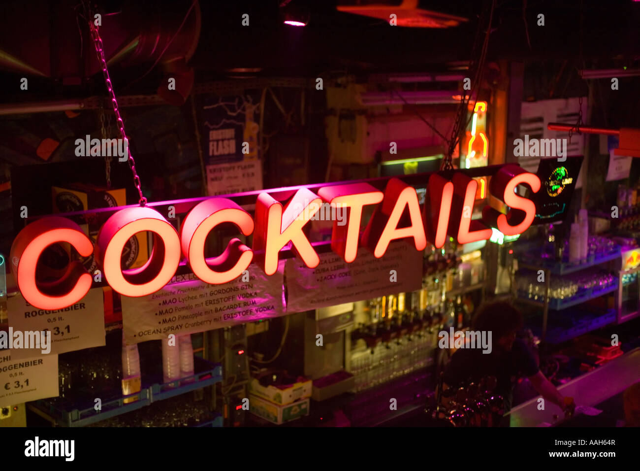 Illuminated text cocktails hanging over the bar of the nightclub Flex ...