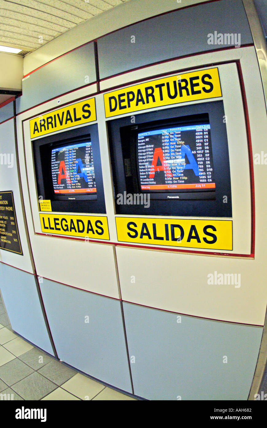 TV monitors for flight schedules at airport Stock Photo - Alamy