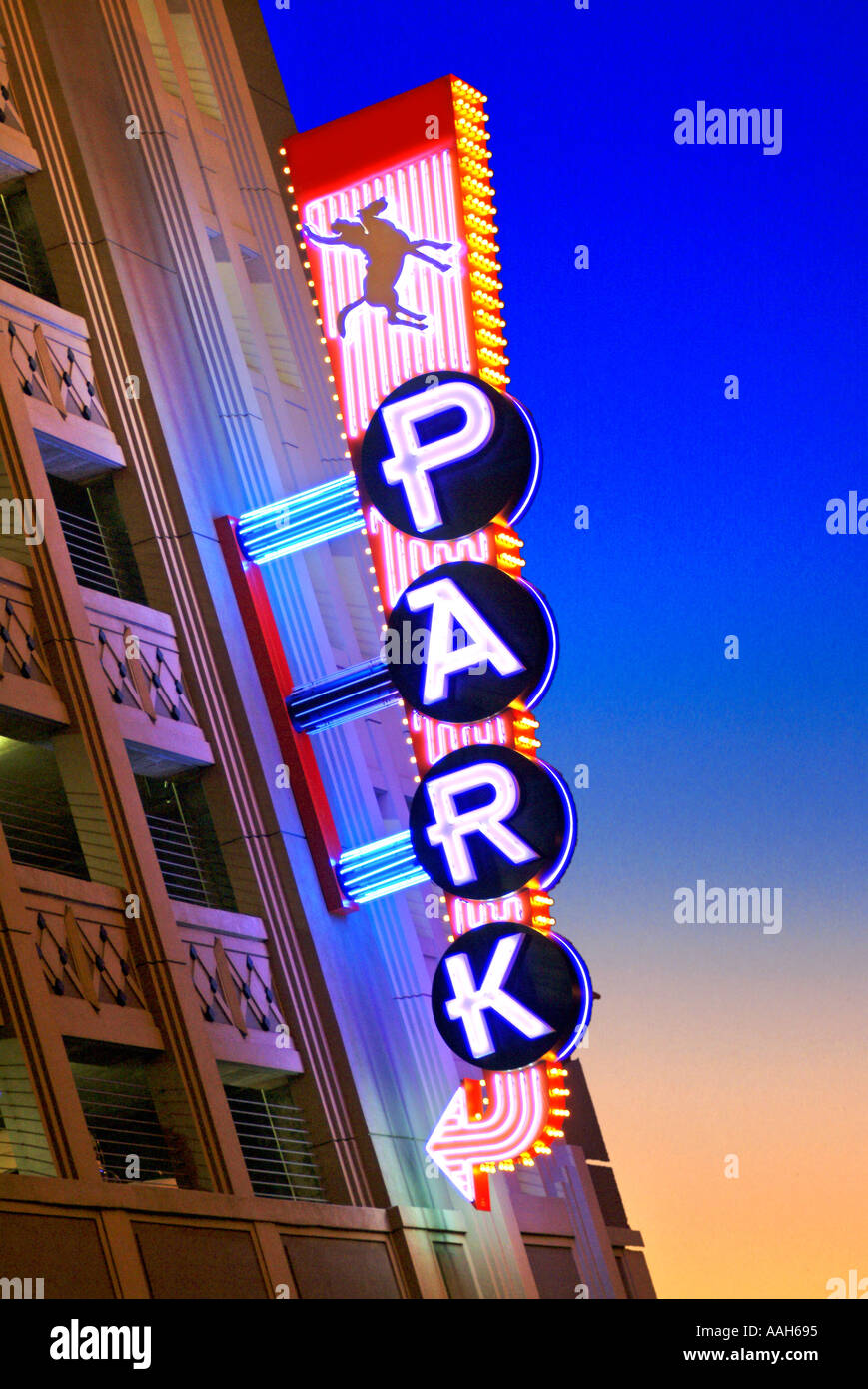 Colorful brightly lit neon parking sign at dusk Stock Photo - Alamy