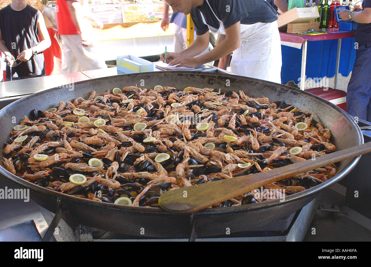 Large paella cooking in a french market Stock Photo - Alamy