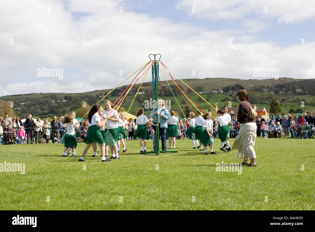 Children from local primary school dancing around the Maypole at MayDay ...