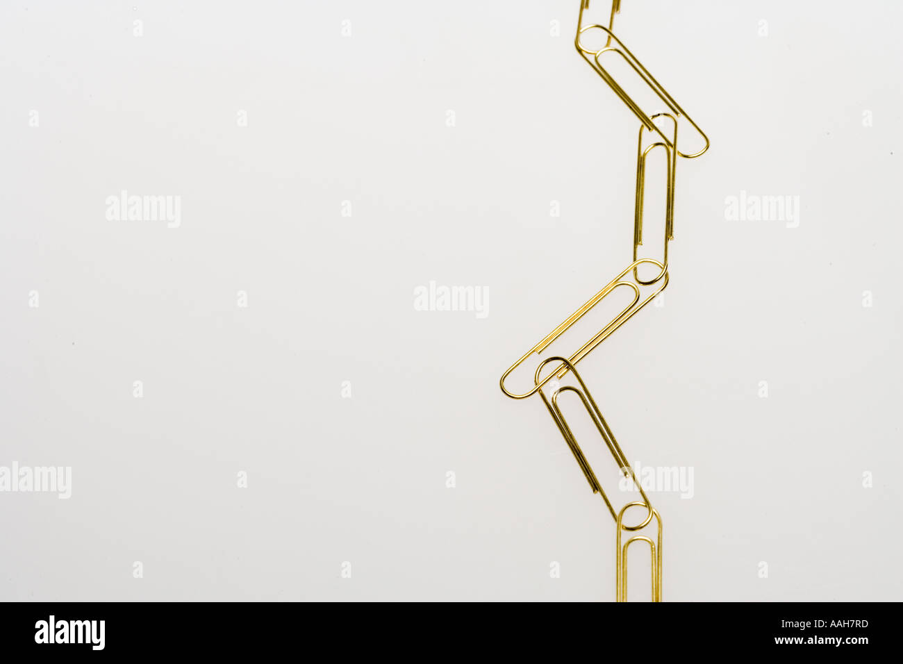 Chain of paperclips representing connection hi-res stock photography ...