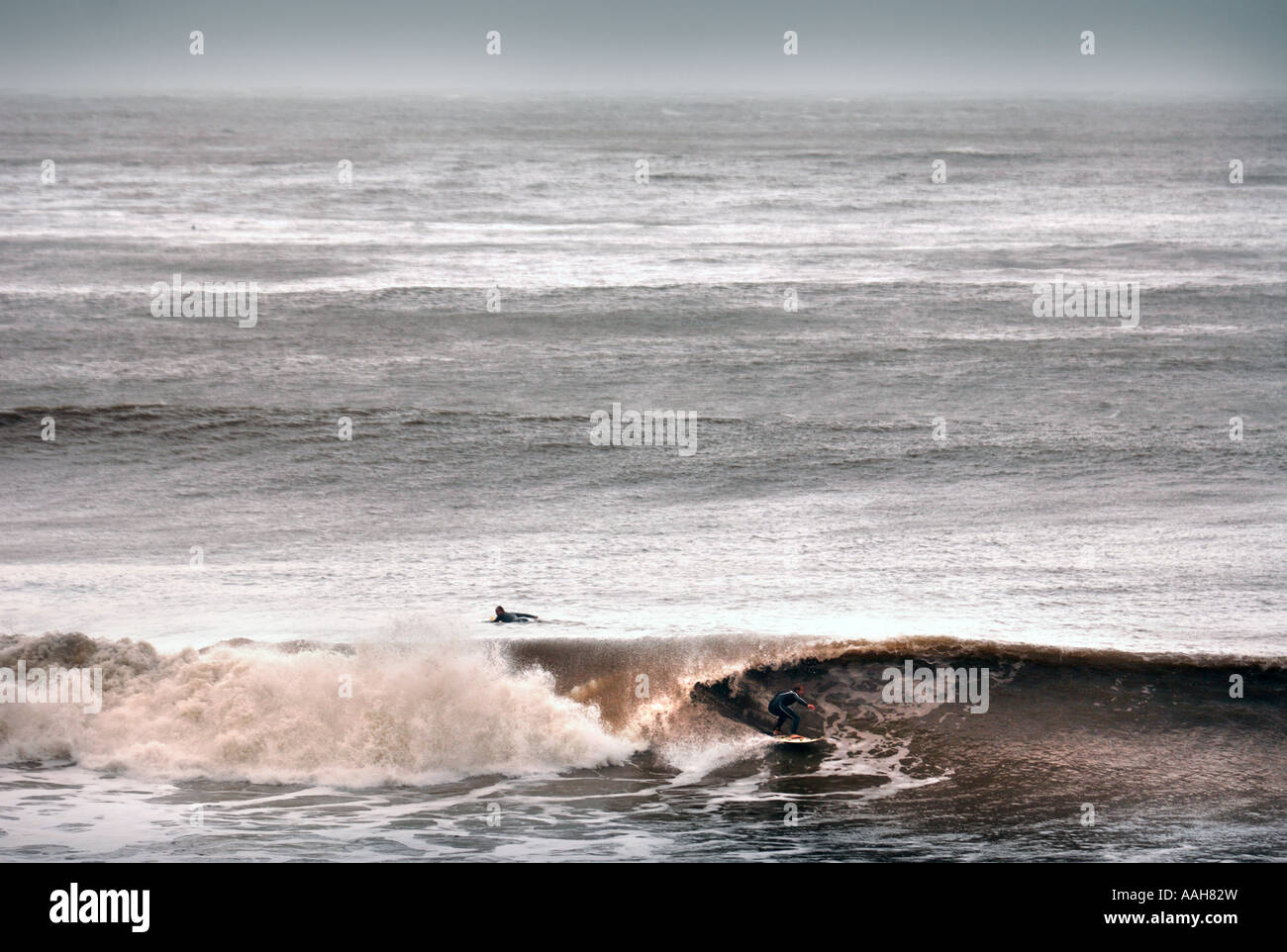 SURFING NEAR THE NORTH DEVON FISHING VILLAGE OF CLOVELLY UK Stock Photo ...