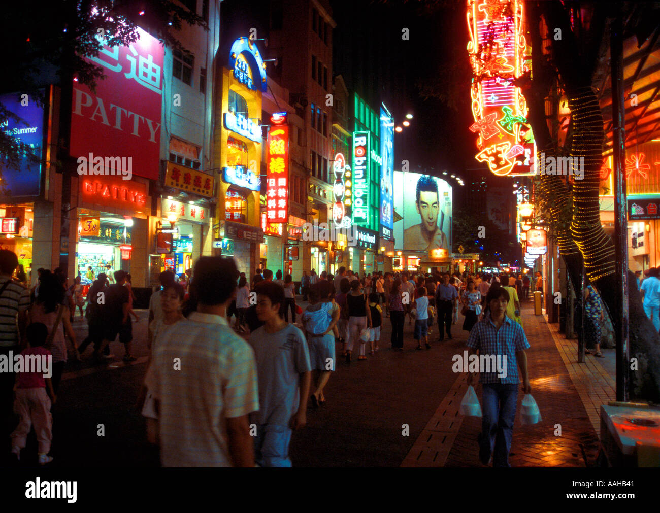 Night time street scene of shopping district in mainland China ...