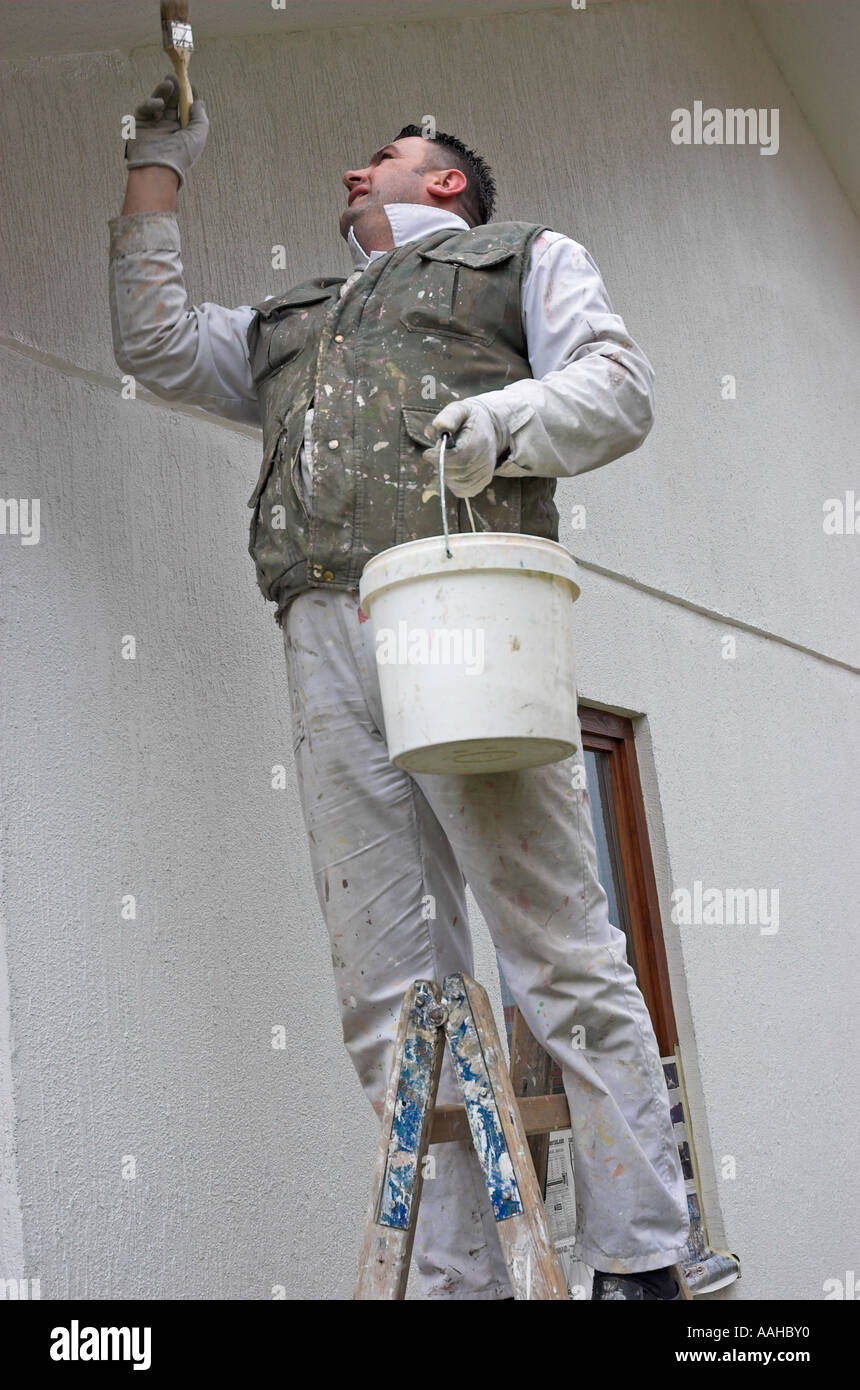 Man with a paint brush hi-res stock photography and images - Alamy