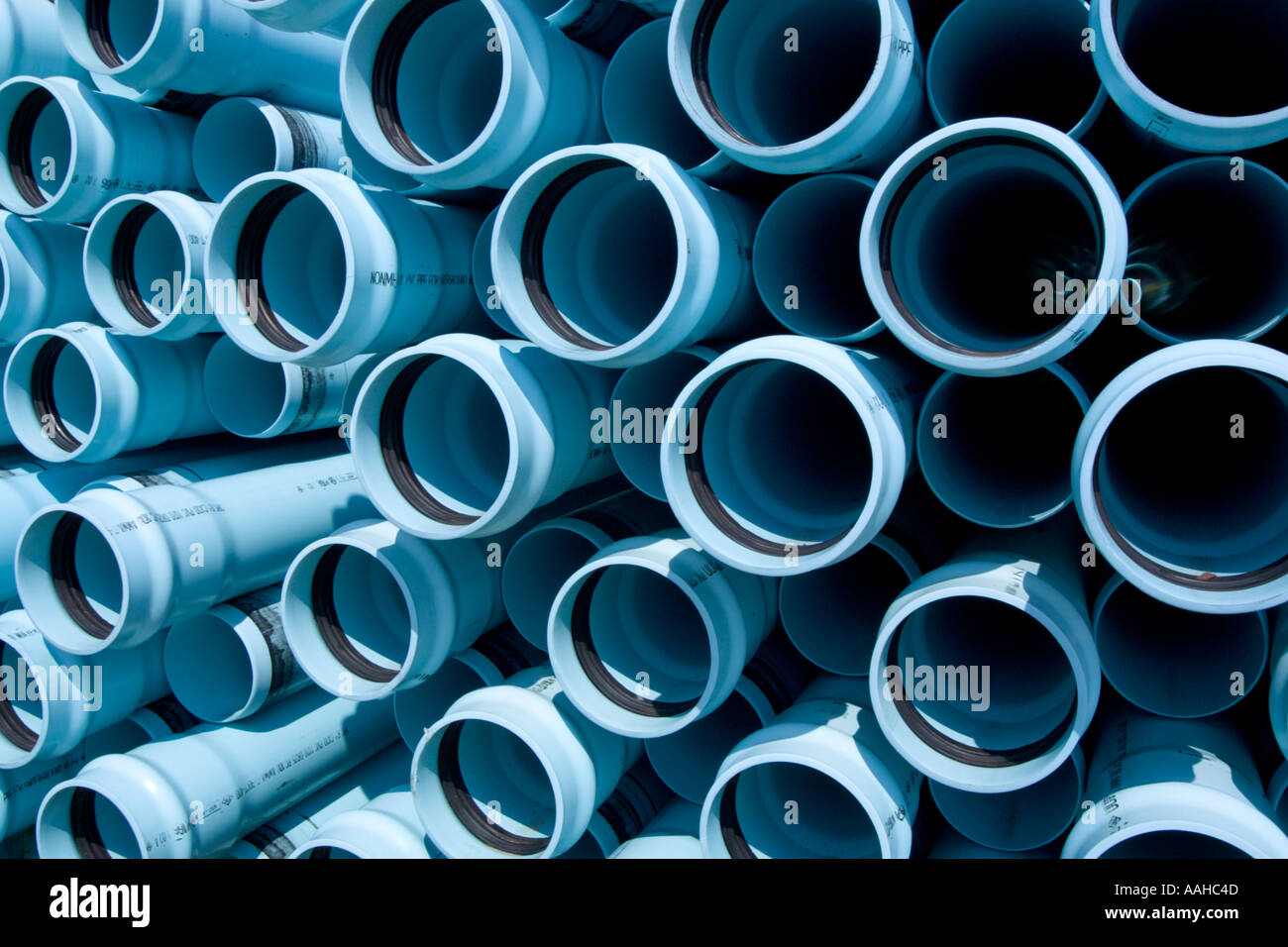 Abstract of a stack of sewer pipe ready for installation in a new ...