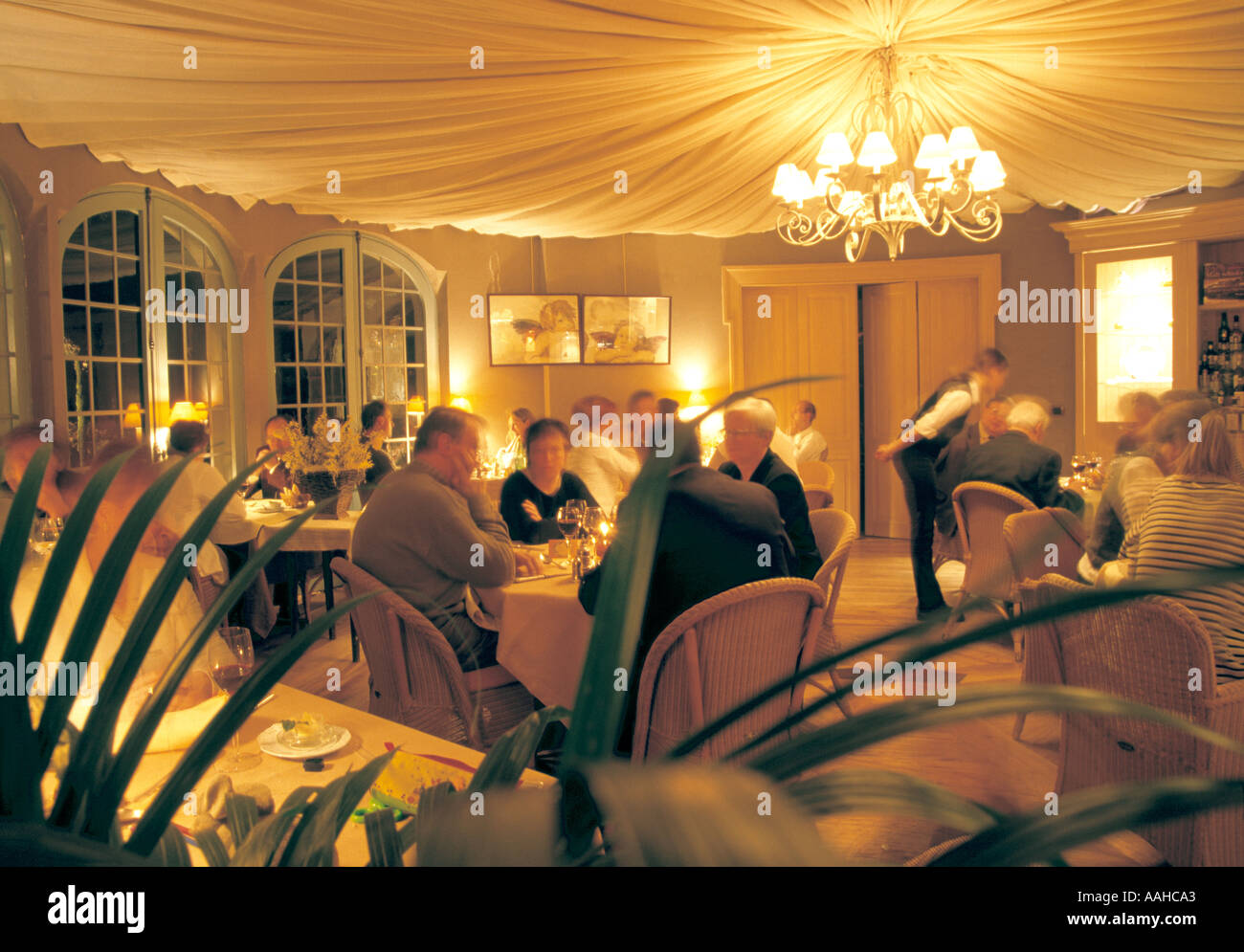 cosy restaurant interior at night Stock Photo - Alamy