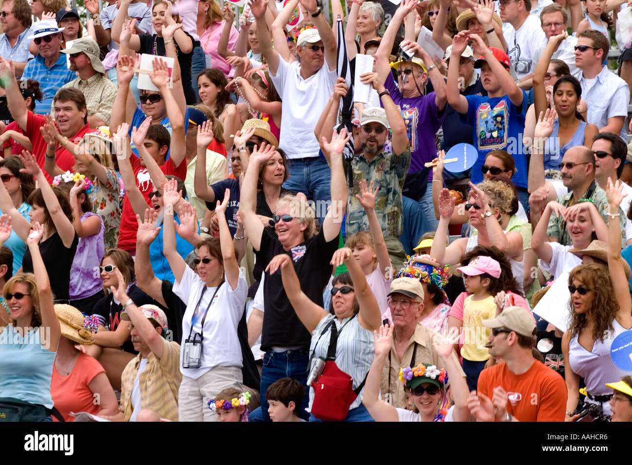 Crowd at Fiesta standing and waving Stock Photo - Alamy