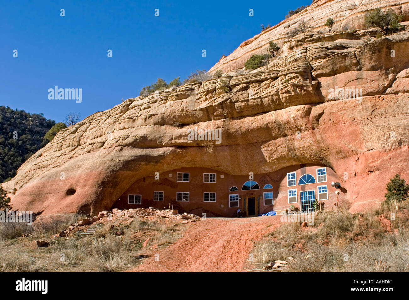 House windows rock face Stock Photo - Alamy