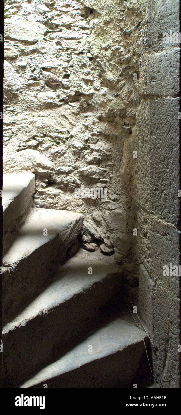 Stone spiral staircase leading up a narrow tower Stock Photo - Alamy