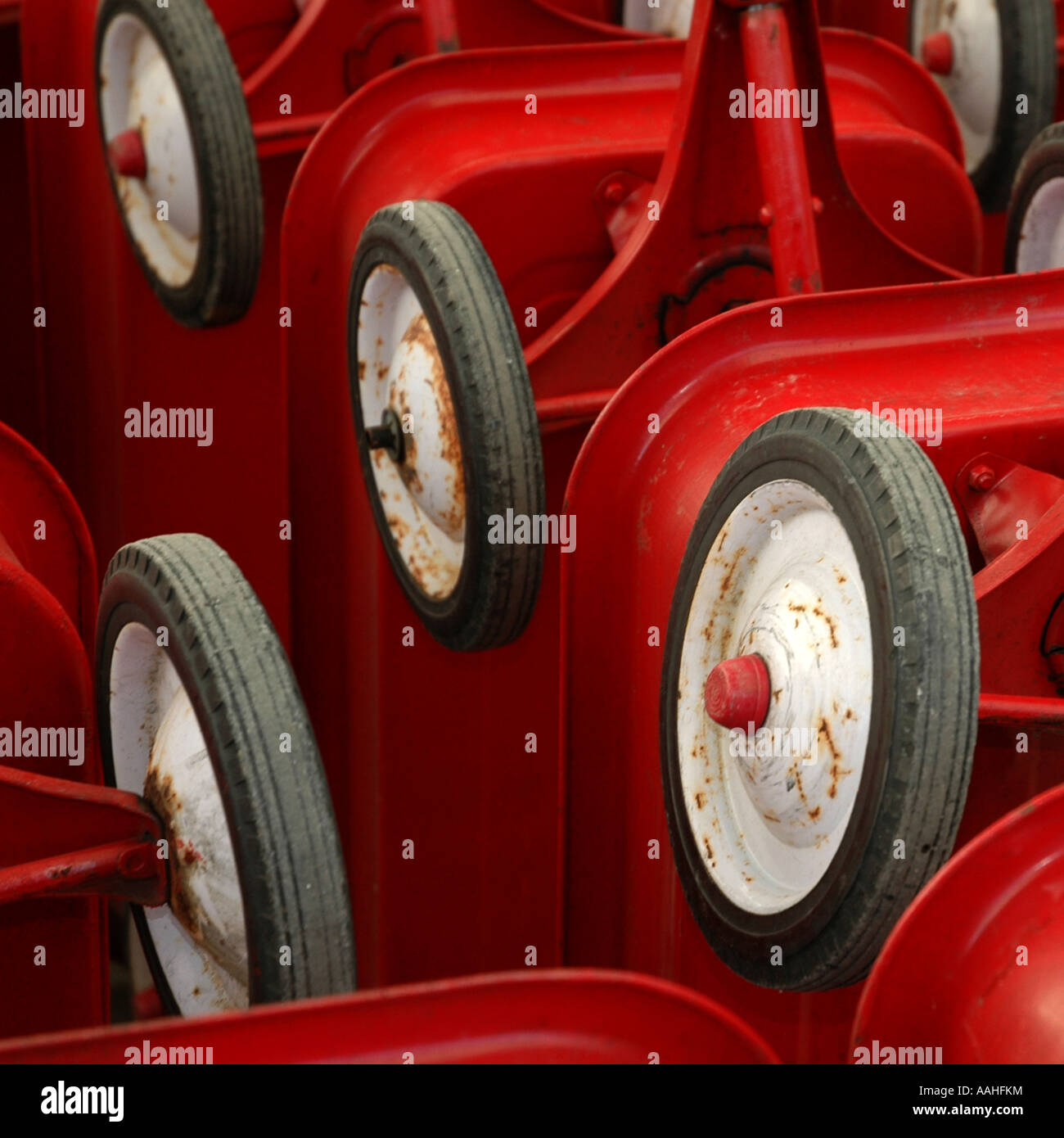 Old red wagons lined up for customer use at a garden center Stock Photo ...
