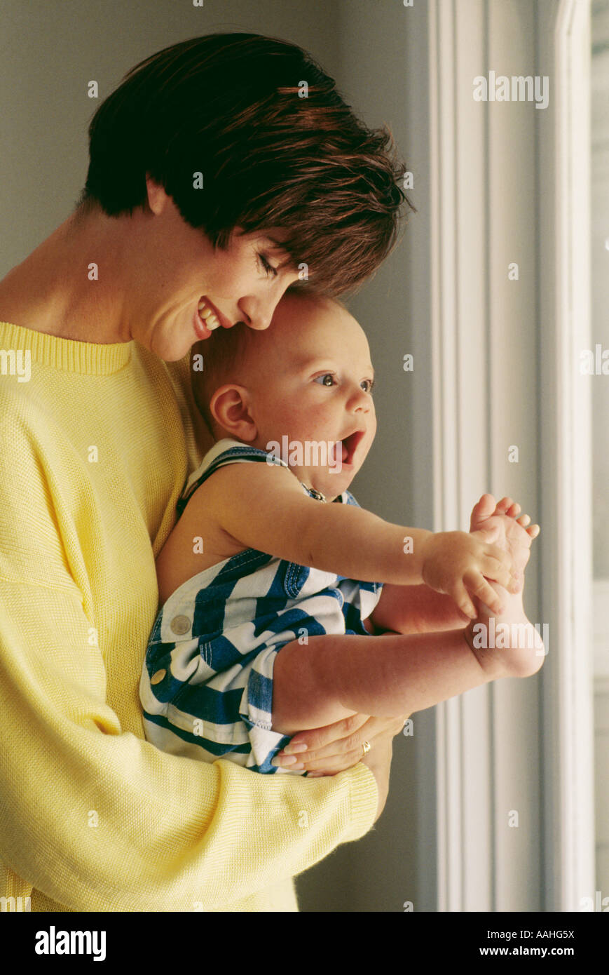 Loving mother cares child in hi-res stock photography and images - Alamy