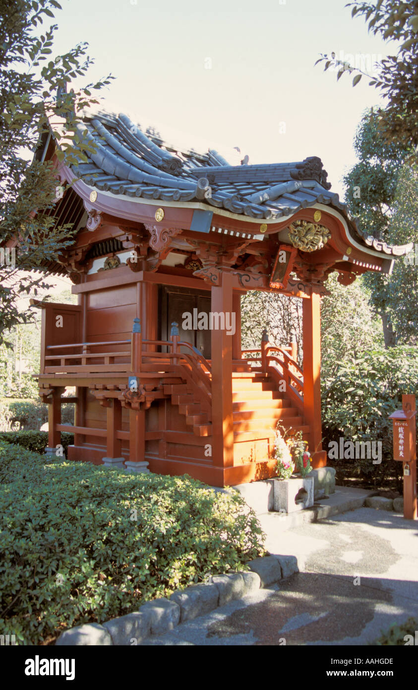 Japan Tokyo Asakusa Temple Garden with small shrines memorials within ...